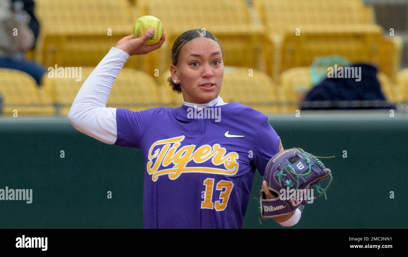 LSU infielder Danieca Coffey (13) throws during an NCAA softball game ...