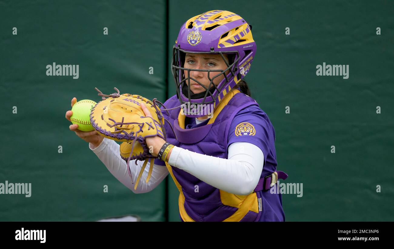 LSU catcher Morgan Cummins (26) throws during an NCAA softball game ...