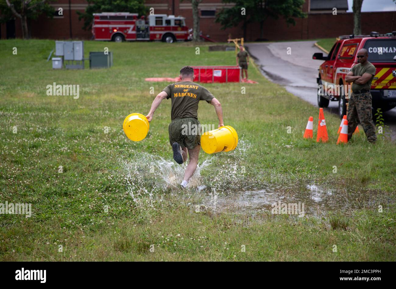 U.S. Marines with Security Battalion participate in a water carry relay ...