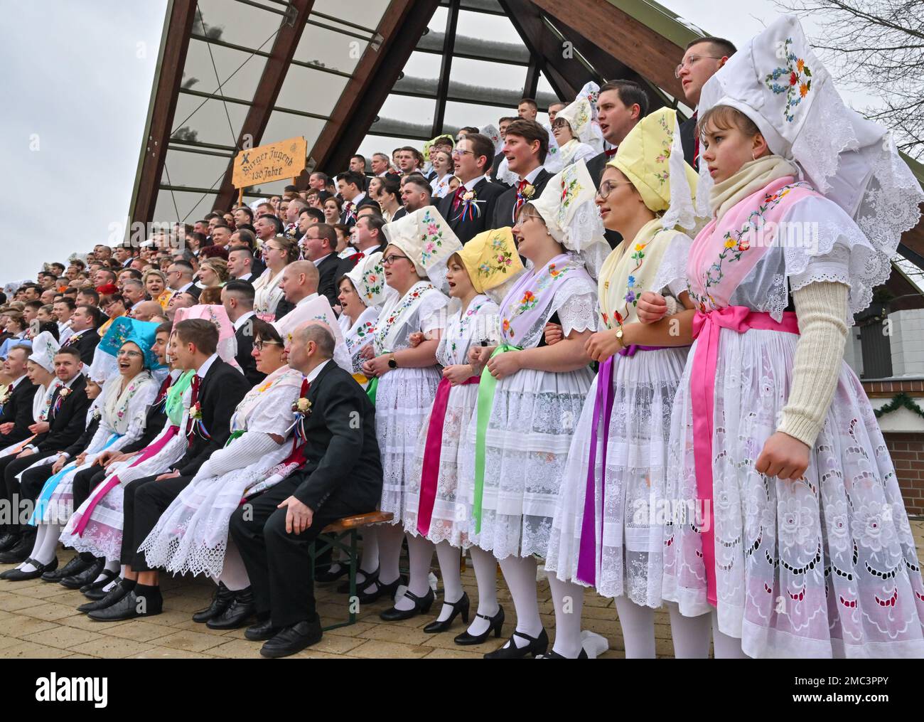 Burg, Germany. 21st Jan, 2023. Young and old couples lined up in ...