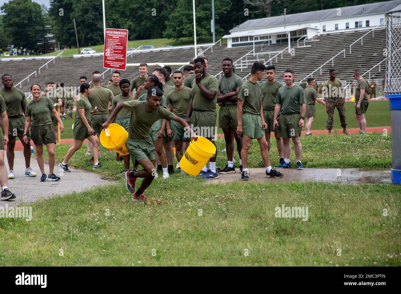 U.S. Marines with Security Battalion participate in a water carry relay ...