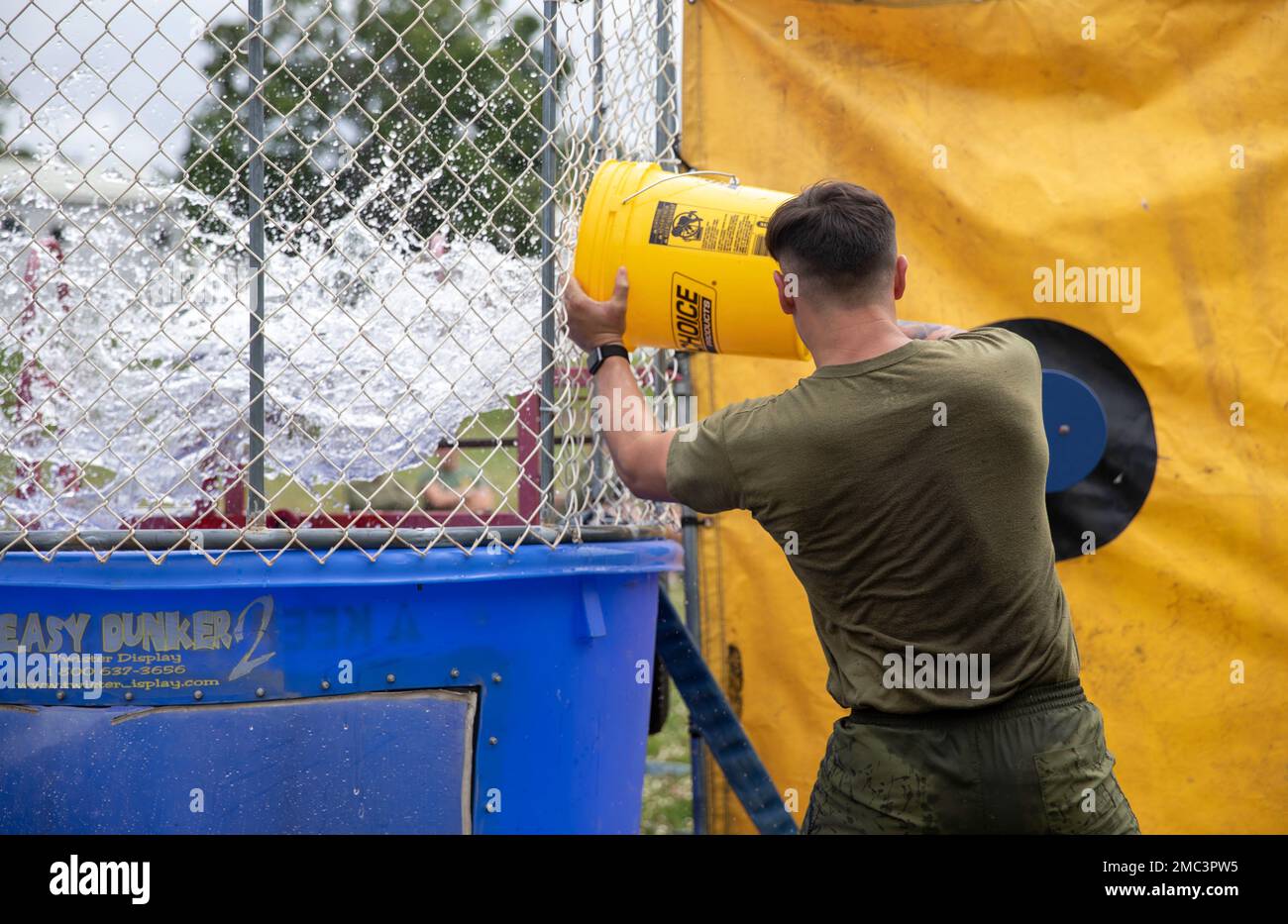 U.S. Marines with Security Battalion participate in a water carry relay ...