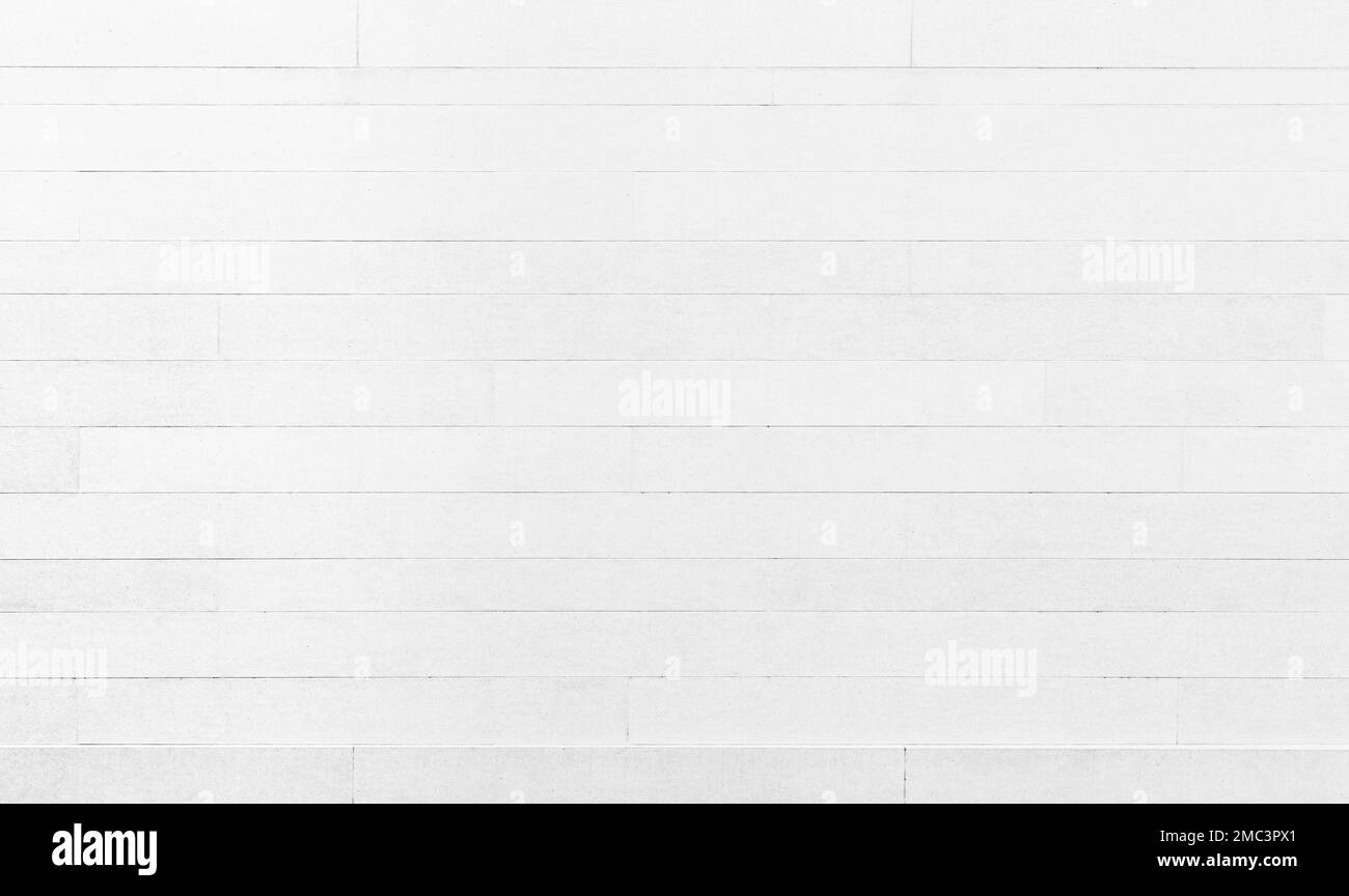 Front view of a new, modern and clean white stone wall or building ...