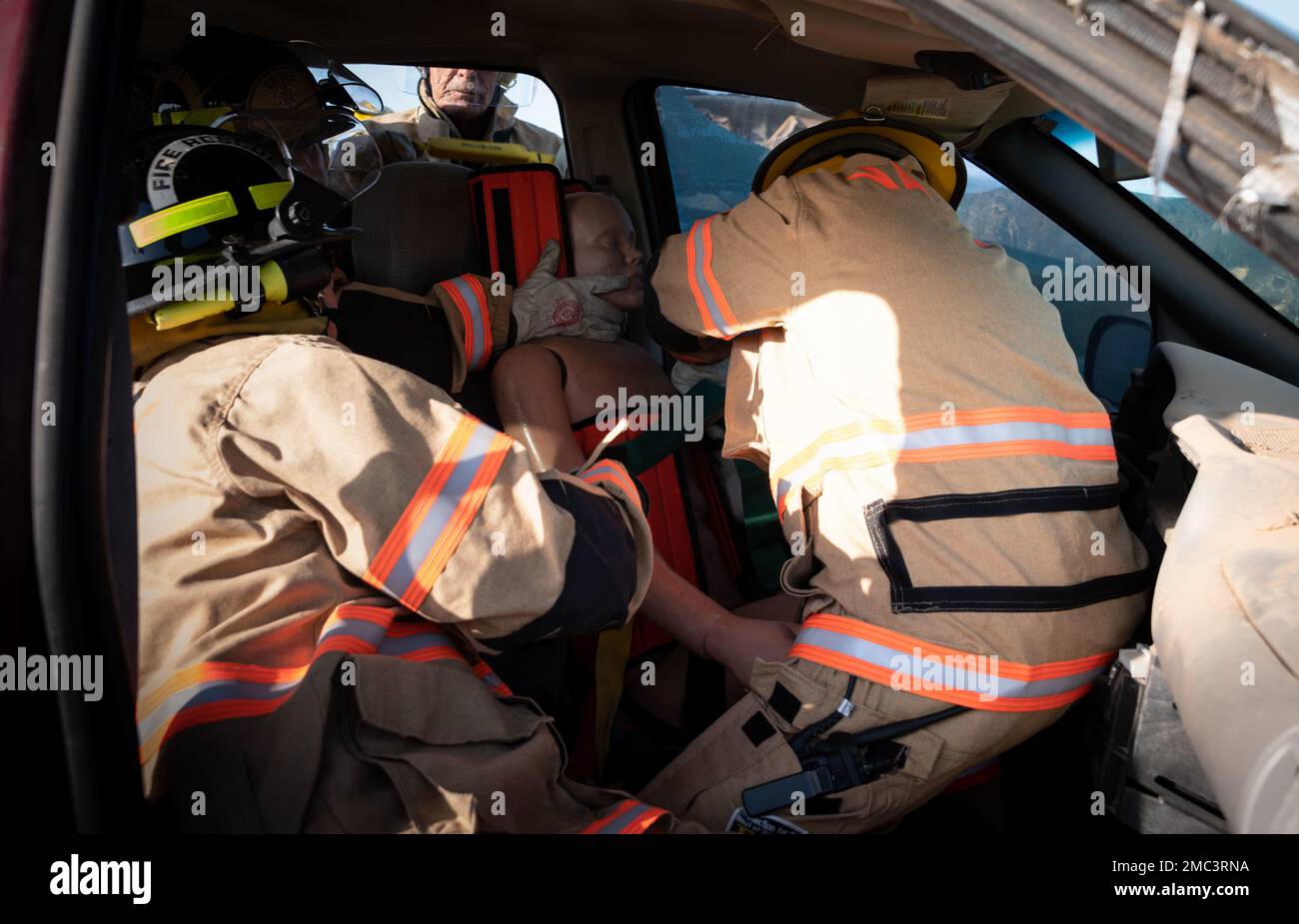 Firefighters execute an auto extrication training exercise at Vance Air ...
