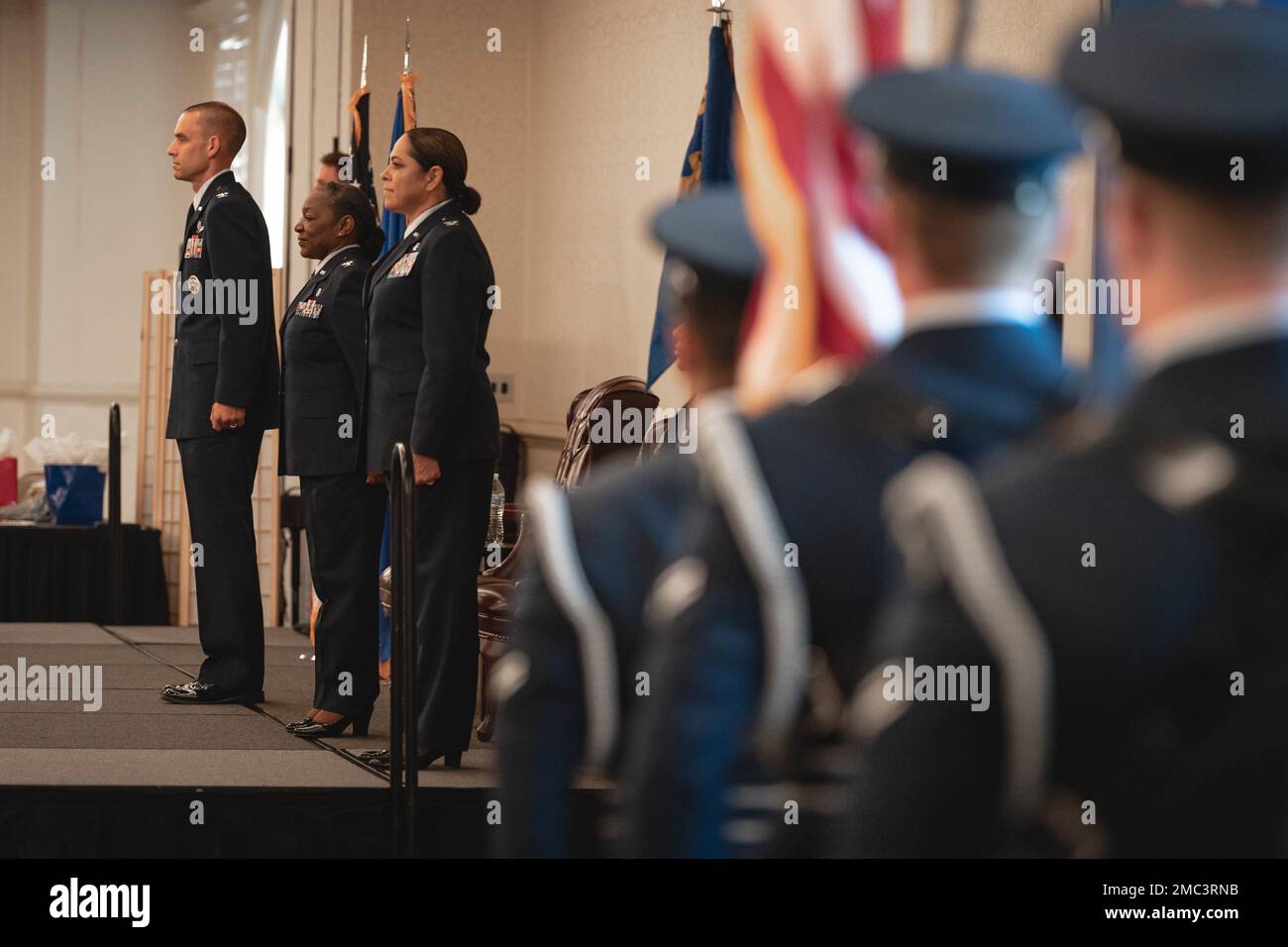 The official party stands at attention during the presentation of ...