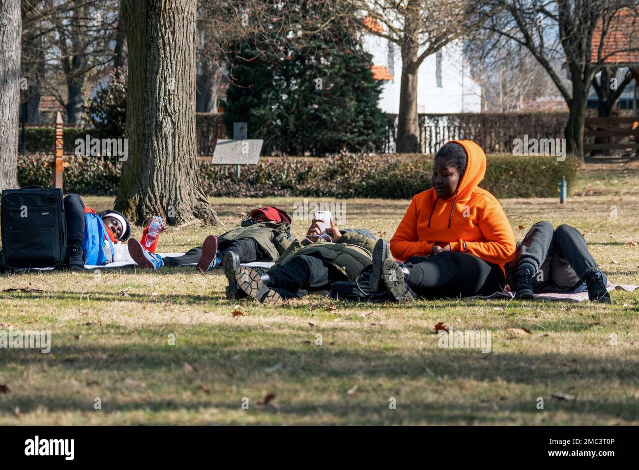 People who arrived from Ternopil, Ukraine gather at a park in ...