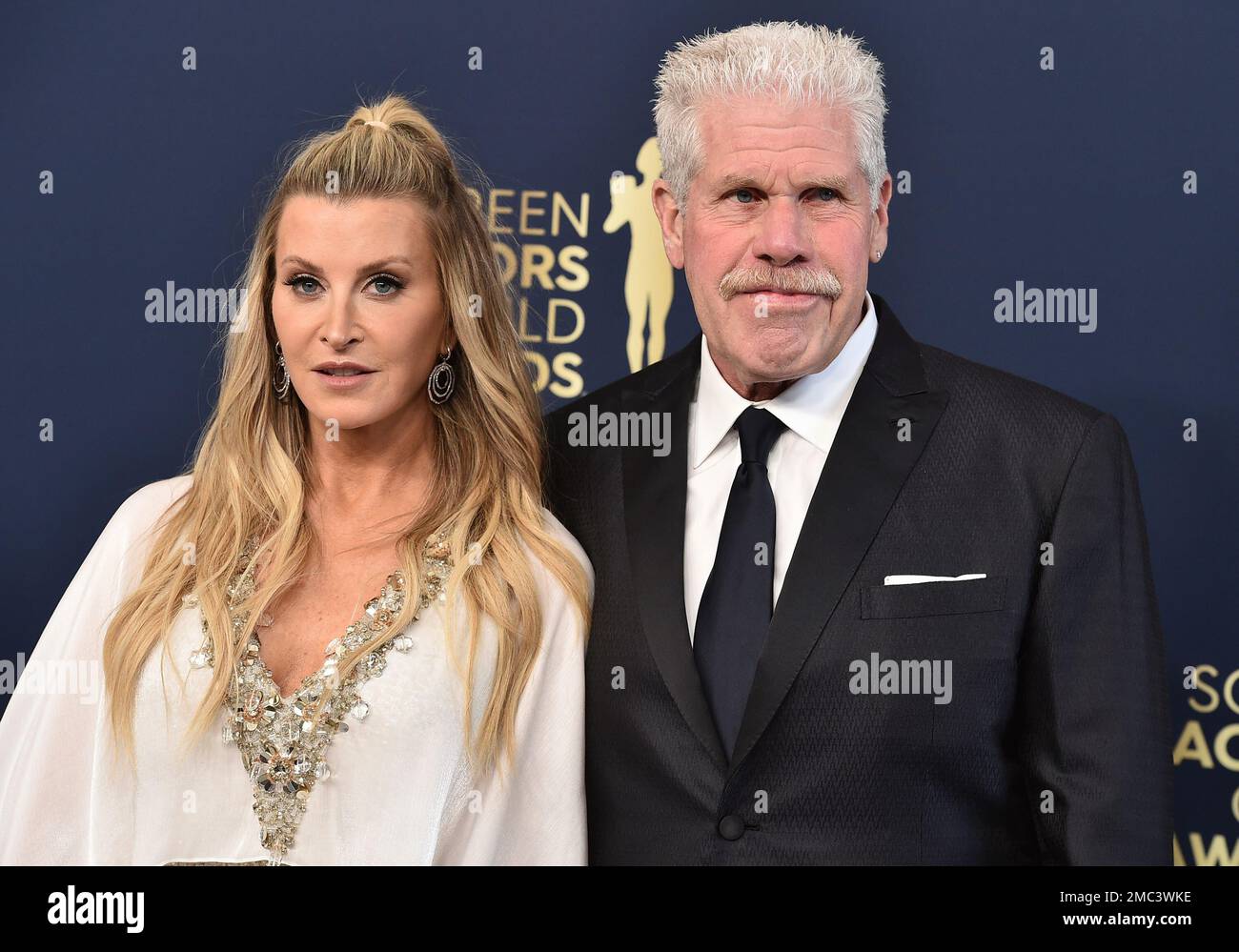Allison Dunbar, left, and Ron Perlman arrive at the 28th annual Screen ...