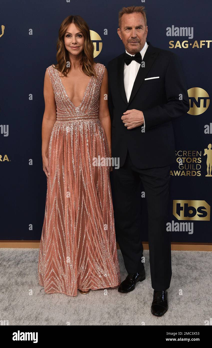 Christine Baumgartner, left, and Kevin Costner arrive at the 28th ...