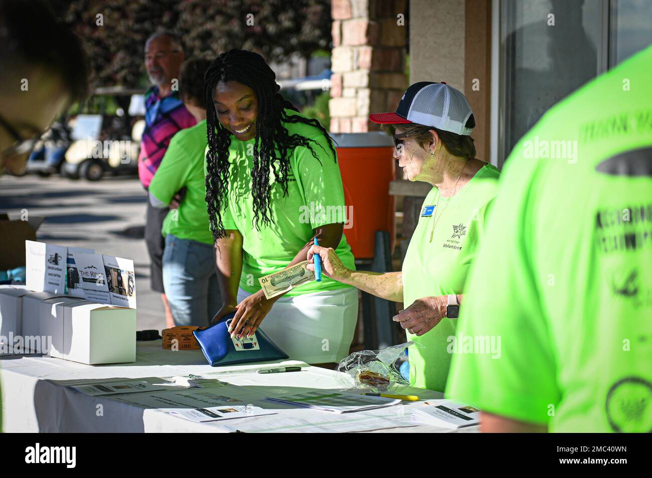 Volunteers count donations as members from Buckley Space Force Base ...