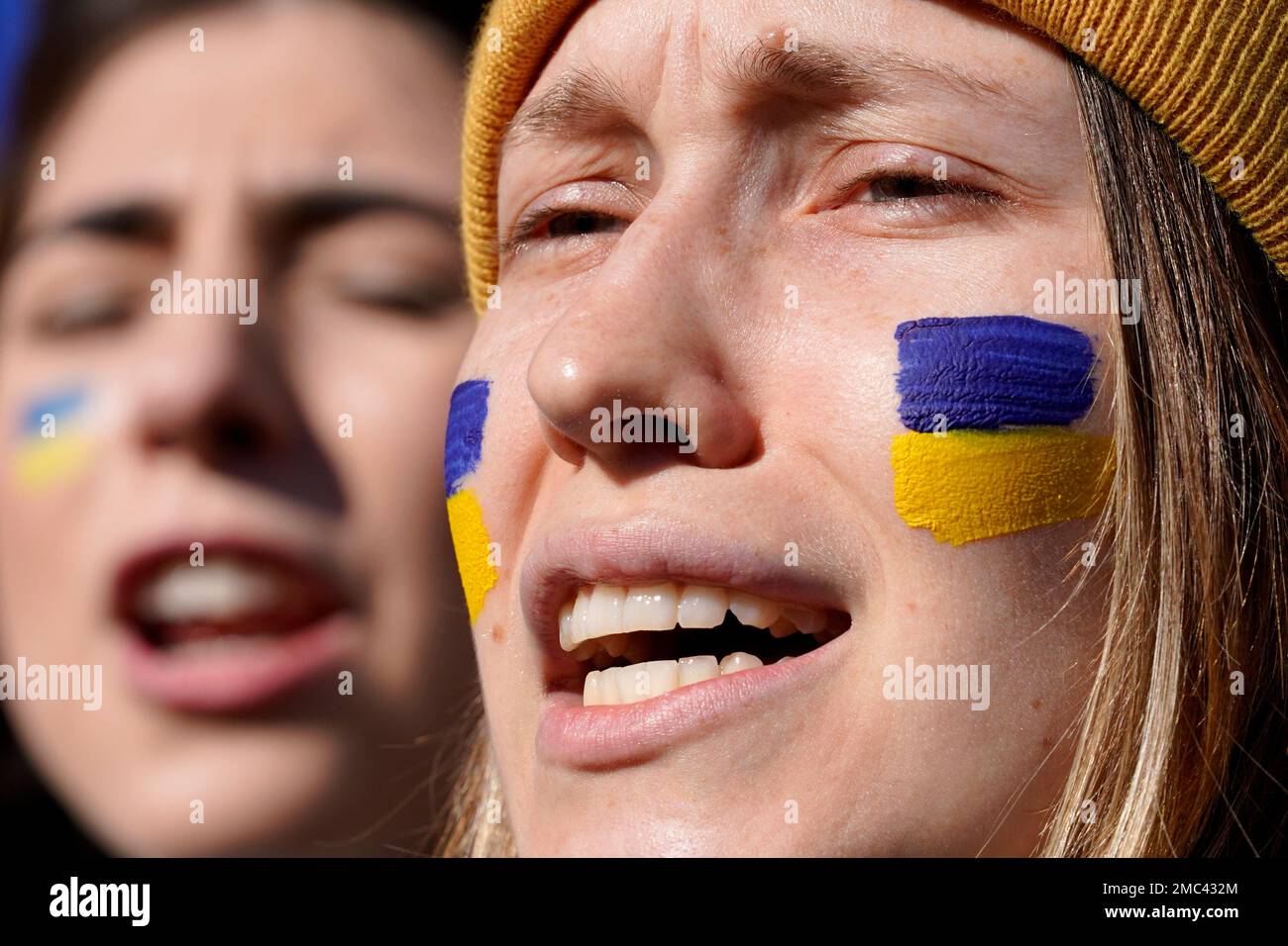 Tetiana Litus, of Boston, right, addresses a crowd during a rally in ...