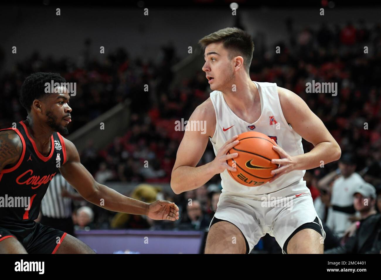 SMU forward Stefan Todorovic tries to pass the ball around Houston ...
