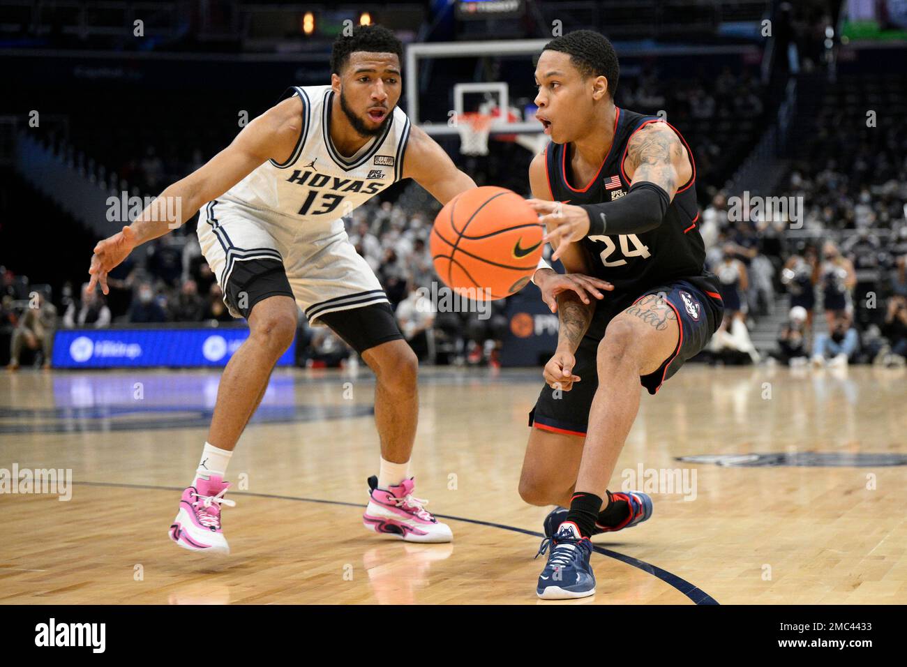 Connecticut guard Jordan Hawkins (24) passes against Georgetown guard ...