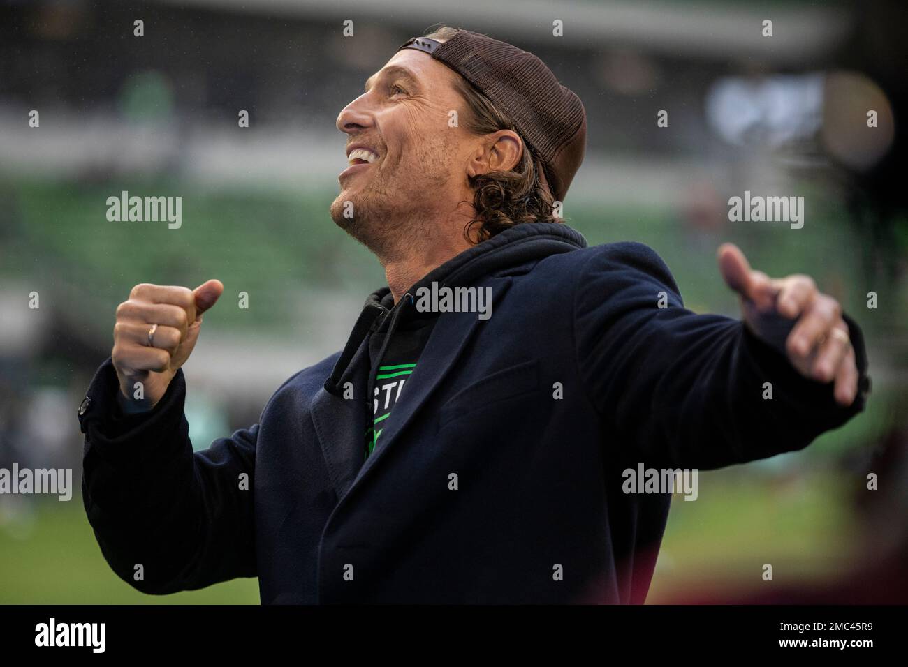 Actor Matthew McConaughey works the crowd before an MLS soccer match ...