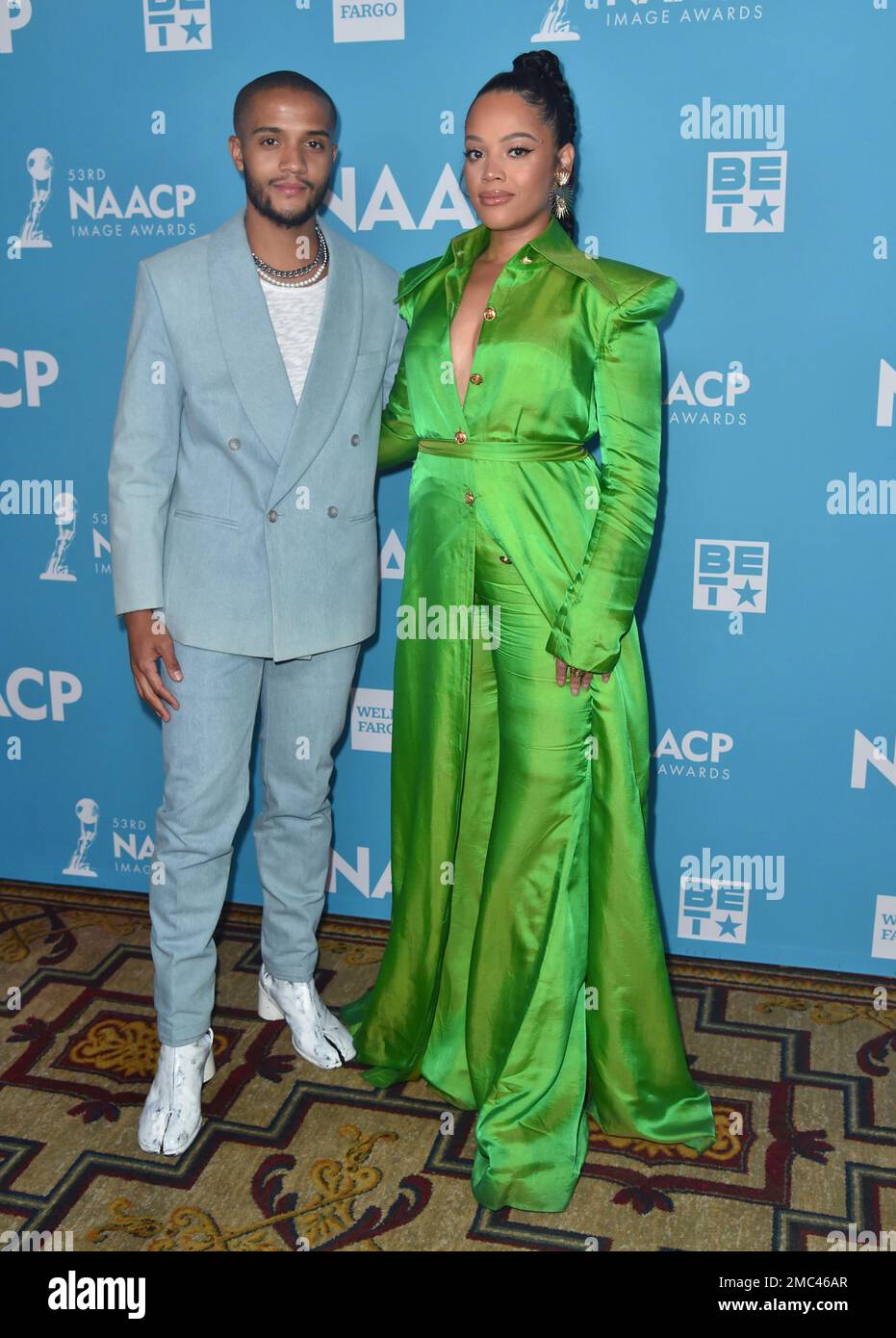 Nic Ashe, left, and Bianca Lawson arrive at the 53rd NAACP Image Awards ...