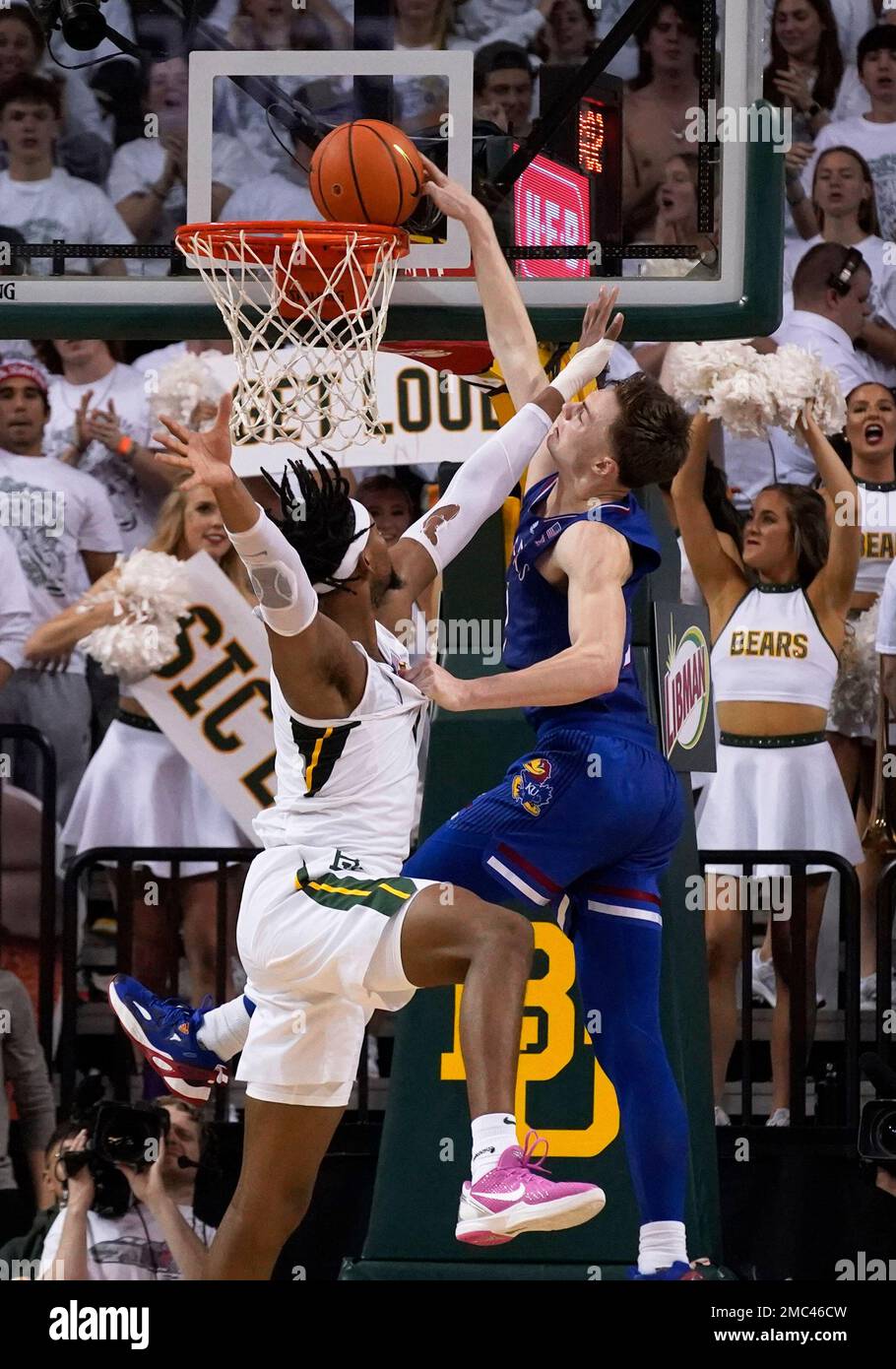 Kansas guard Christian Braun, right, is fouled by Baylor forward Flo ...