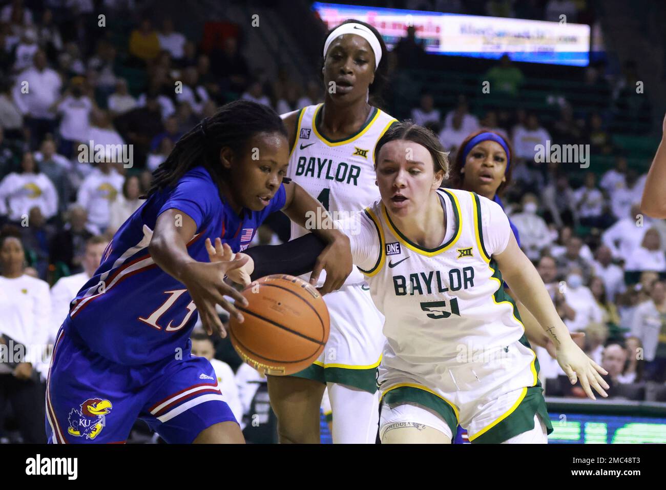 Baylor forward Caitlin Bickle, right, reaches in on Kansas guard ...