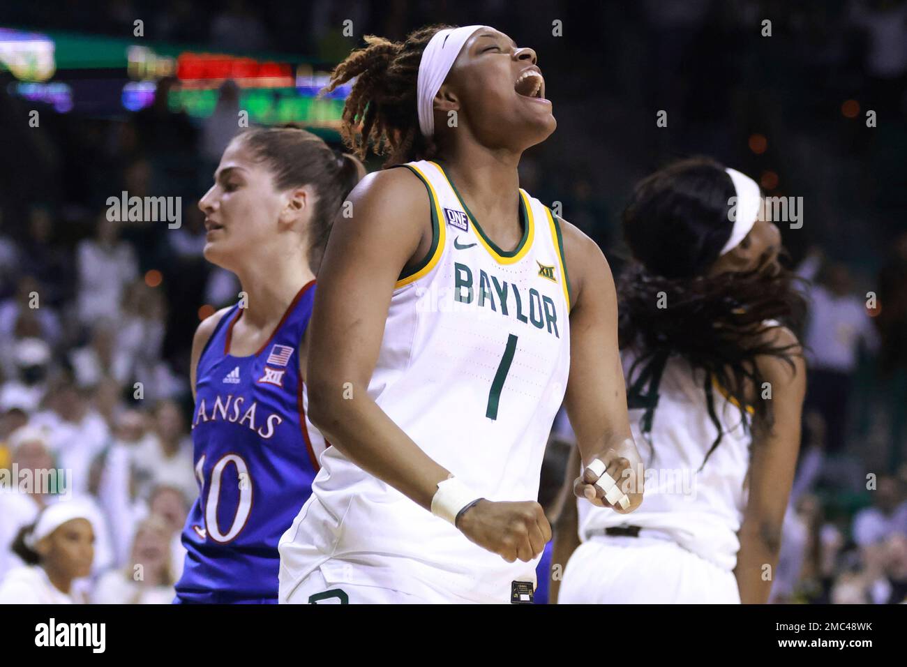 Baylor forward NaLyssa Smith reacts to a foul as Kansas guard Julie ...