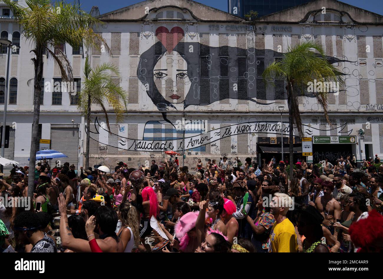 Revelers dance during an unofficial carnival block party referred to as ...