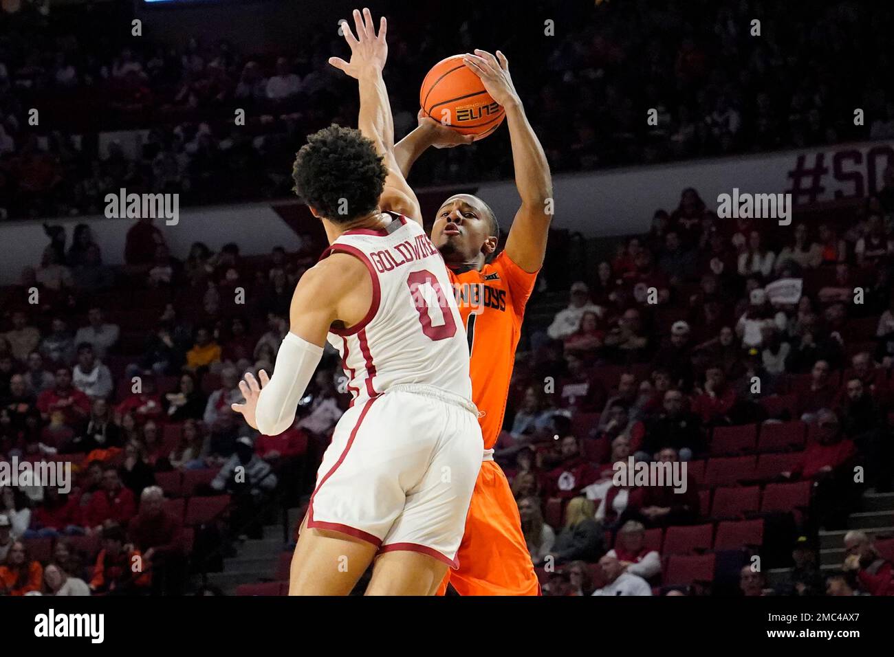 Oklahoma State guard Bryce Thompson, right, shoots as Oklahoma guard ...