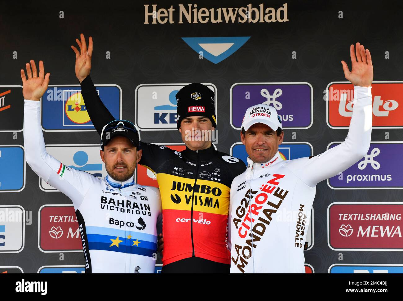 First place, Belgium's Wout Van Aert of Jumbo Visma, center, celebrates ...
