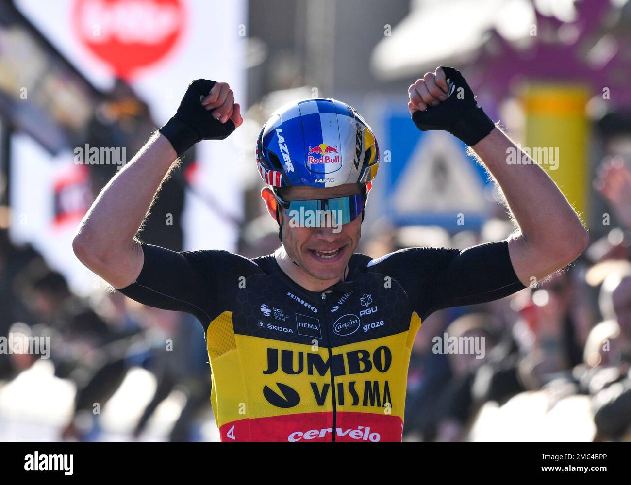 Belgium's Wout Van Aert of the Jumbo Visma team crosses the finish line ...
