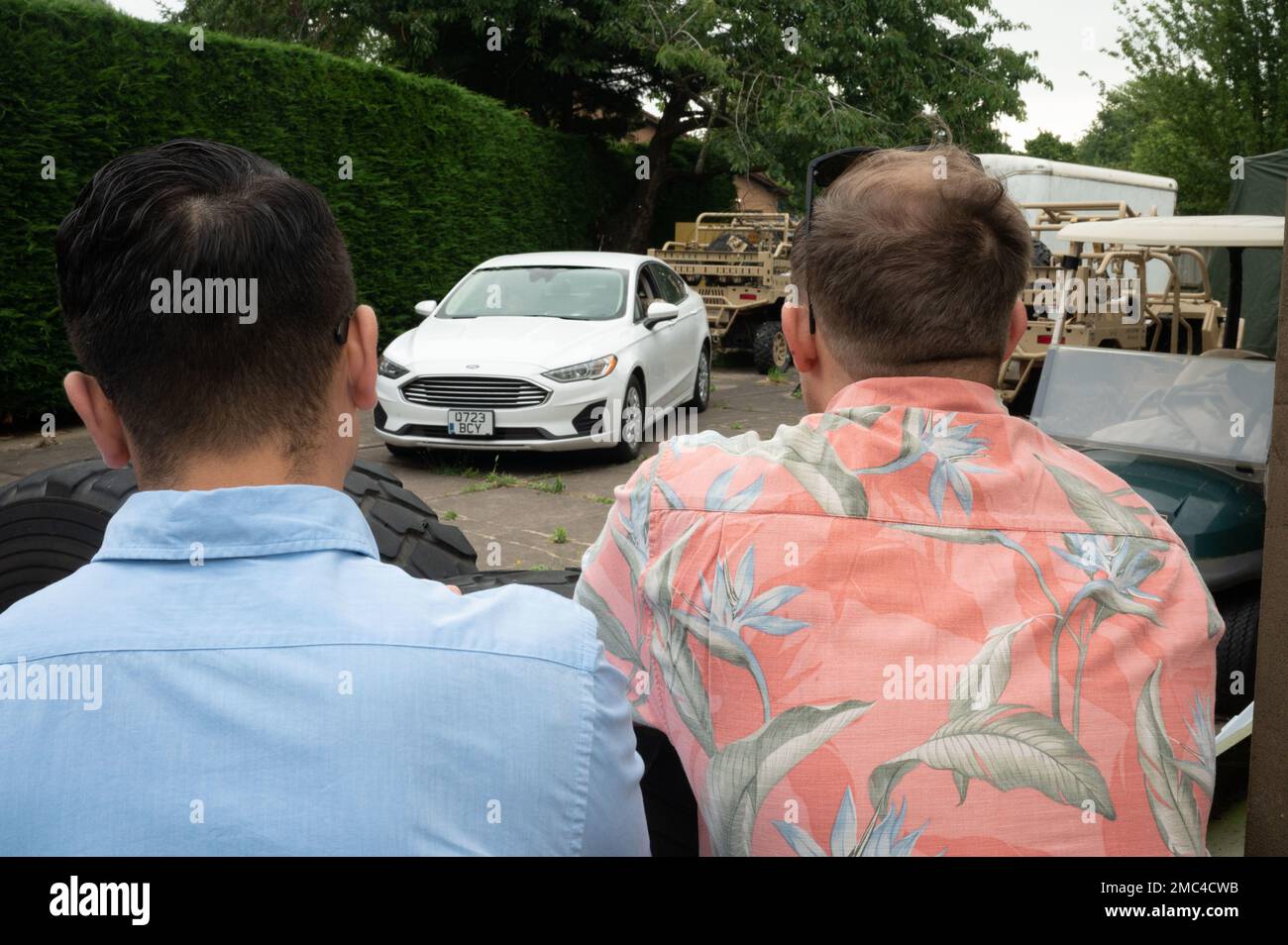 Airmen from the 48th and the 100th Security Forces Squadrons speak with ...