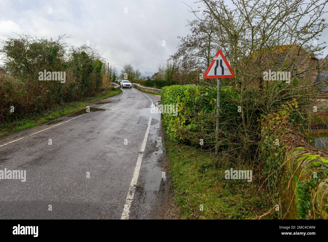 Narrow bridge road sign with car on bridge Stock Photo - Alamy