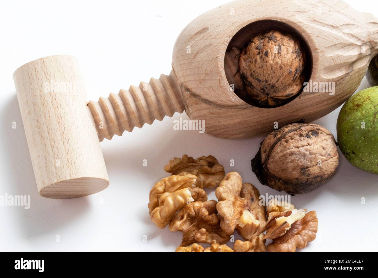 Handmade wooden nuts and nutcrackers Stock Photo - Alamy