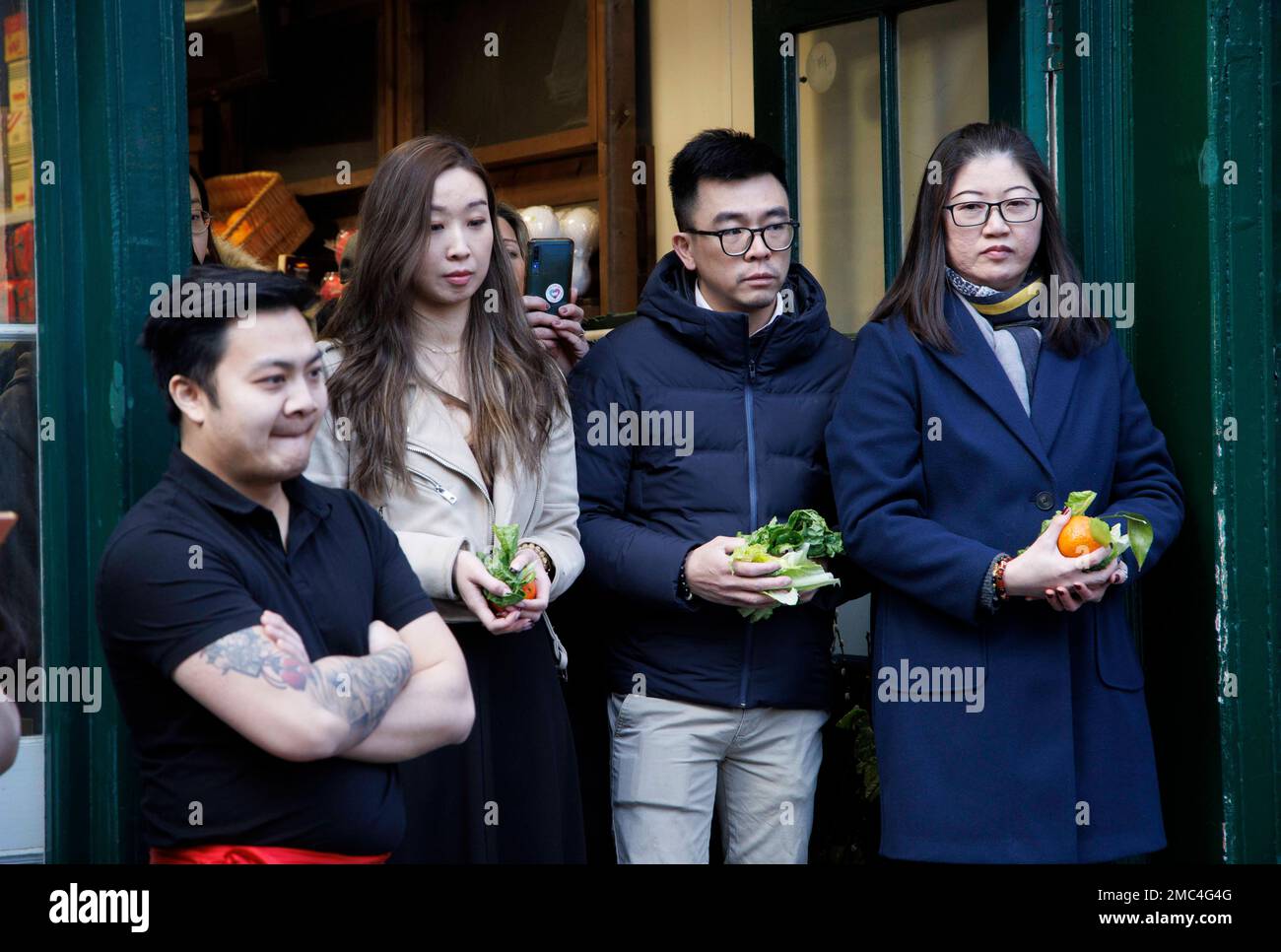 London, UK. 21st Jan, 2023. The shop owners receive gifts from the ...