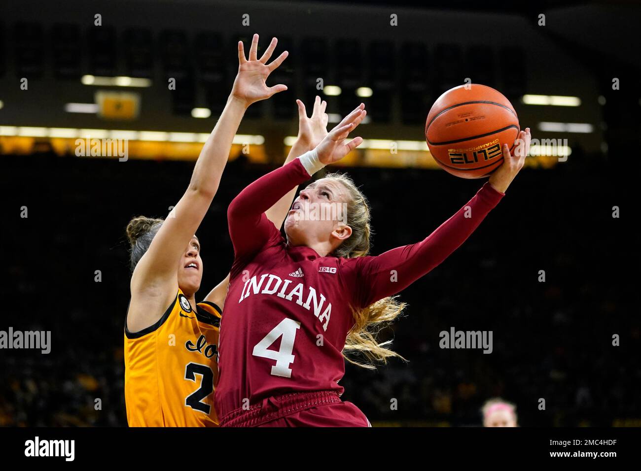 Indiana guard Nicole Cardano-Hillary (4) shoots over Iowa guard Gabbie ...