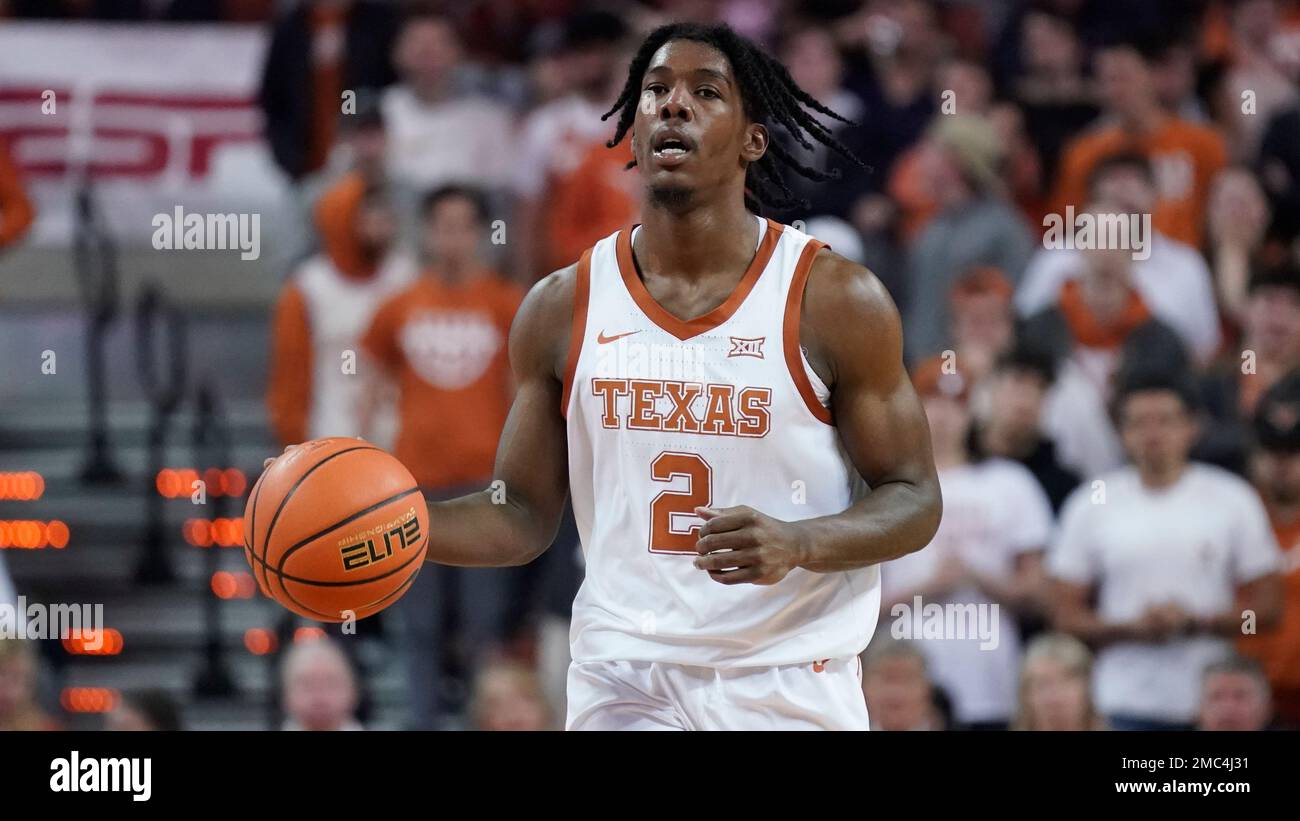 Texas guard Marcus Carr (2) brings the ball up the court against TCU ...