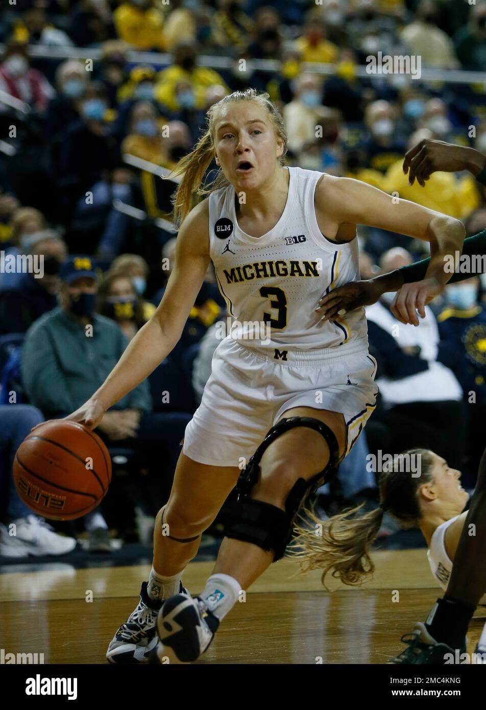 Michigan guard Maddie Nolan (3) drives to the basket against Michigan ...