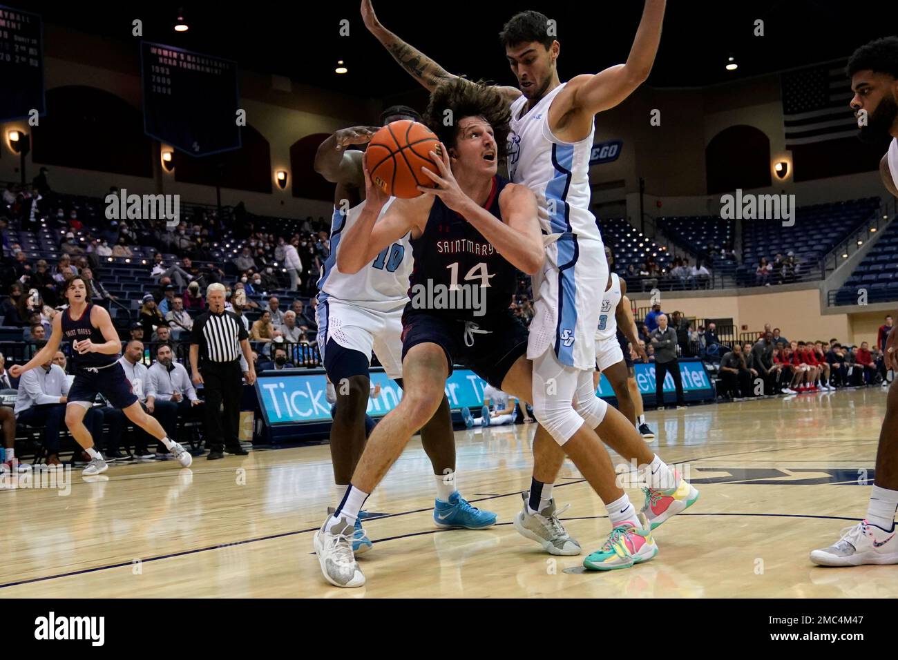 St. Mary's forward Kyle Bowen (14) looks to shoot as San Diego forward ...