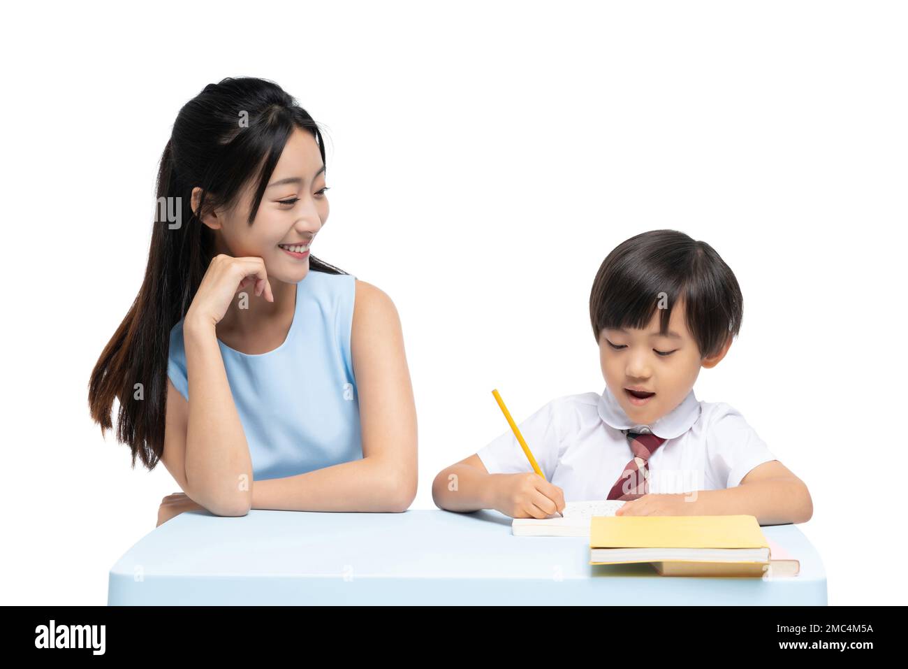 A young female teacher counseling boy learning Stock Photo - Alamy