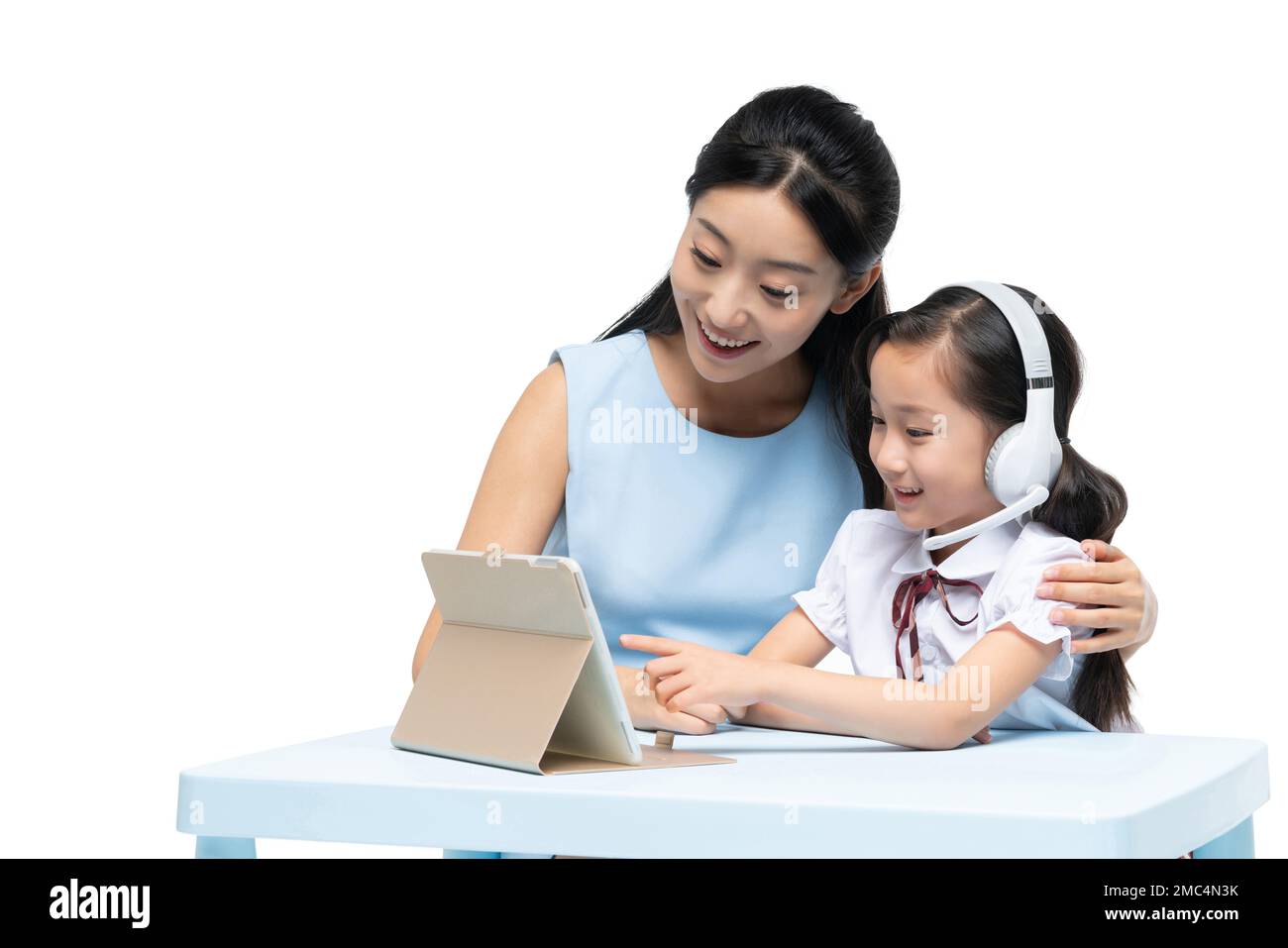A young female teacher counseling students learning Stock Photo - Alamy