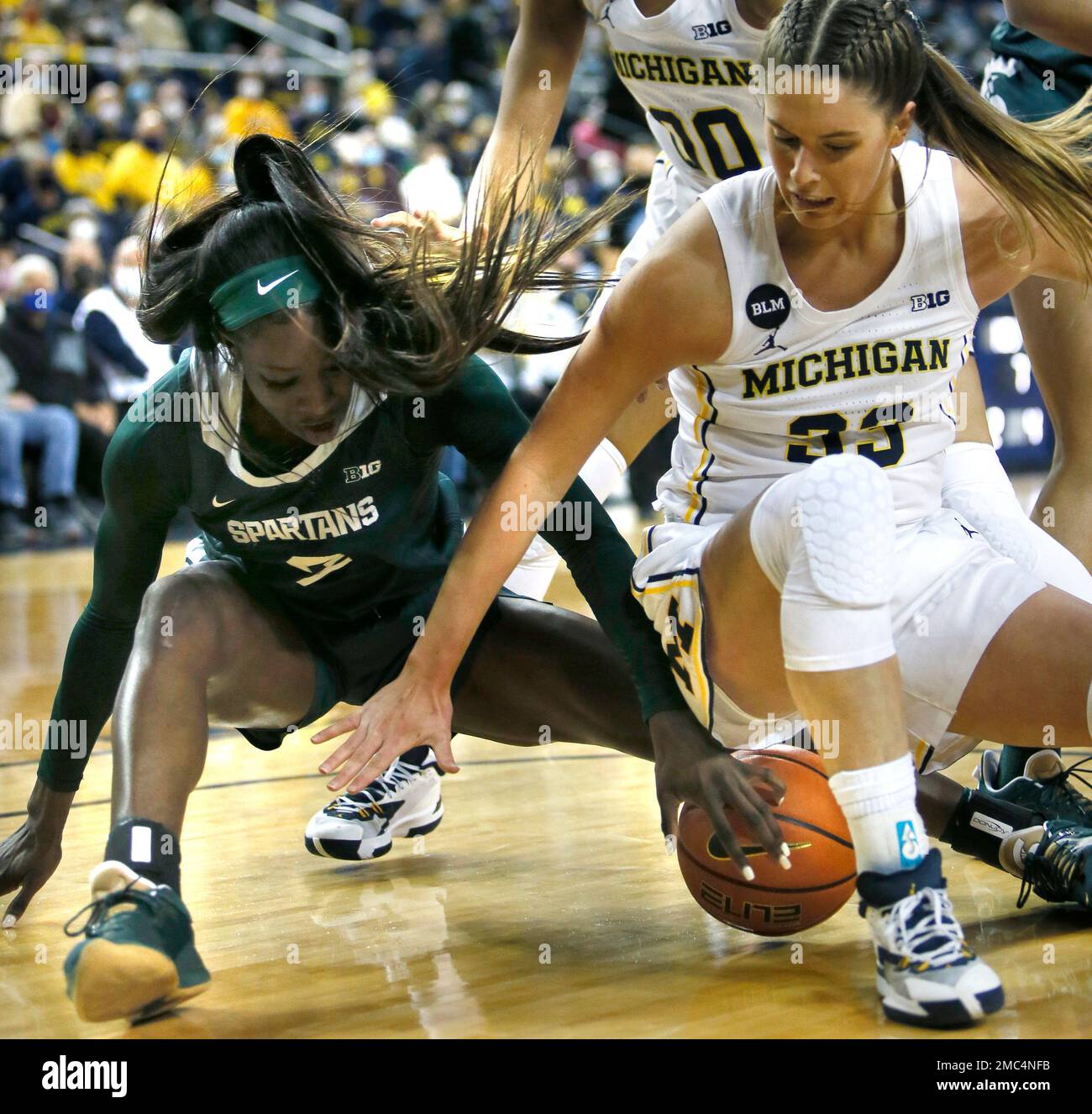 Michigan State forward Tamara Farquhar, left, and Michigan forward ...