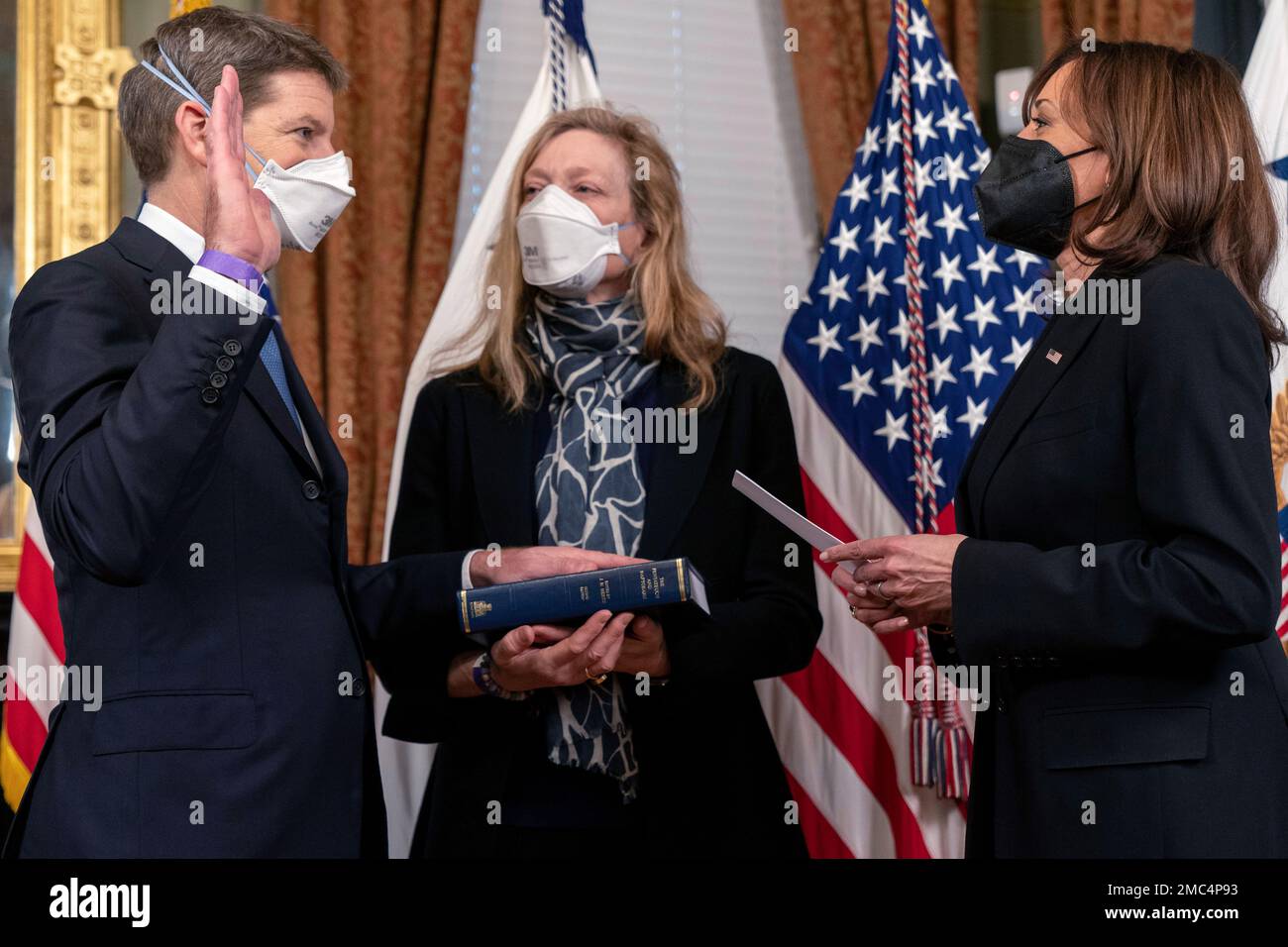 Vice President Kamala Harrisceremonially swears in Scott Nathan, left ...