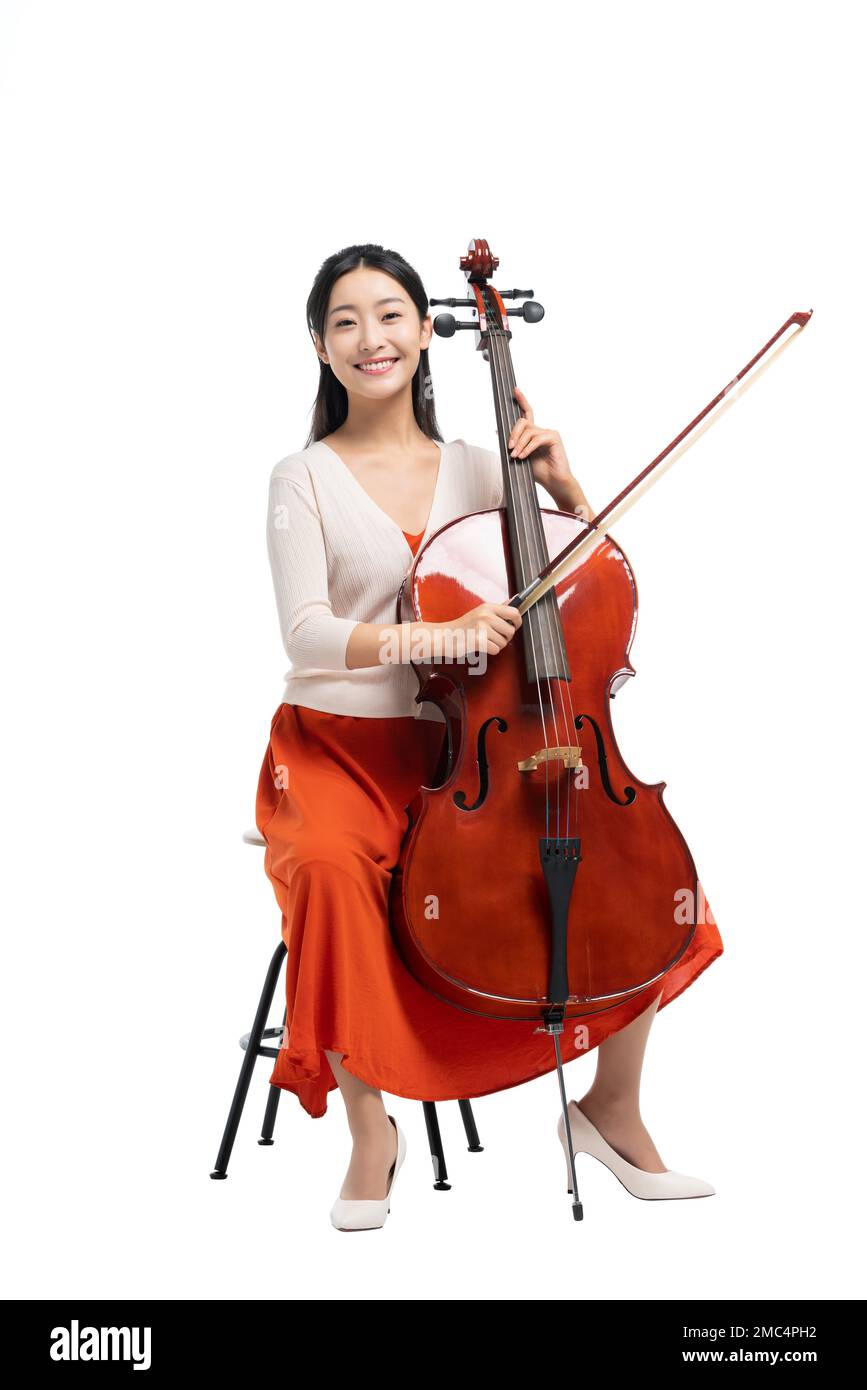 A young woman and the cello Stock Photo - Alamy
