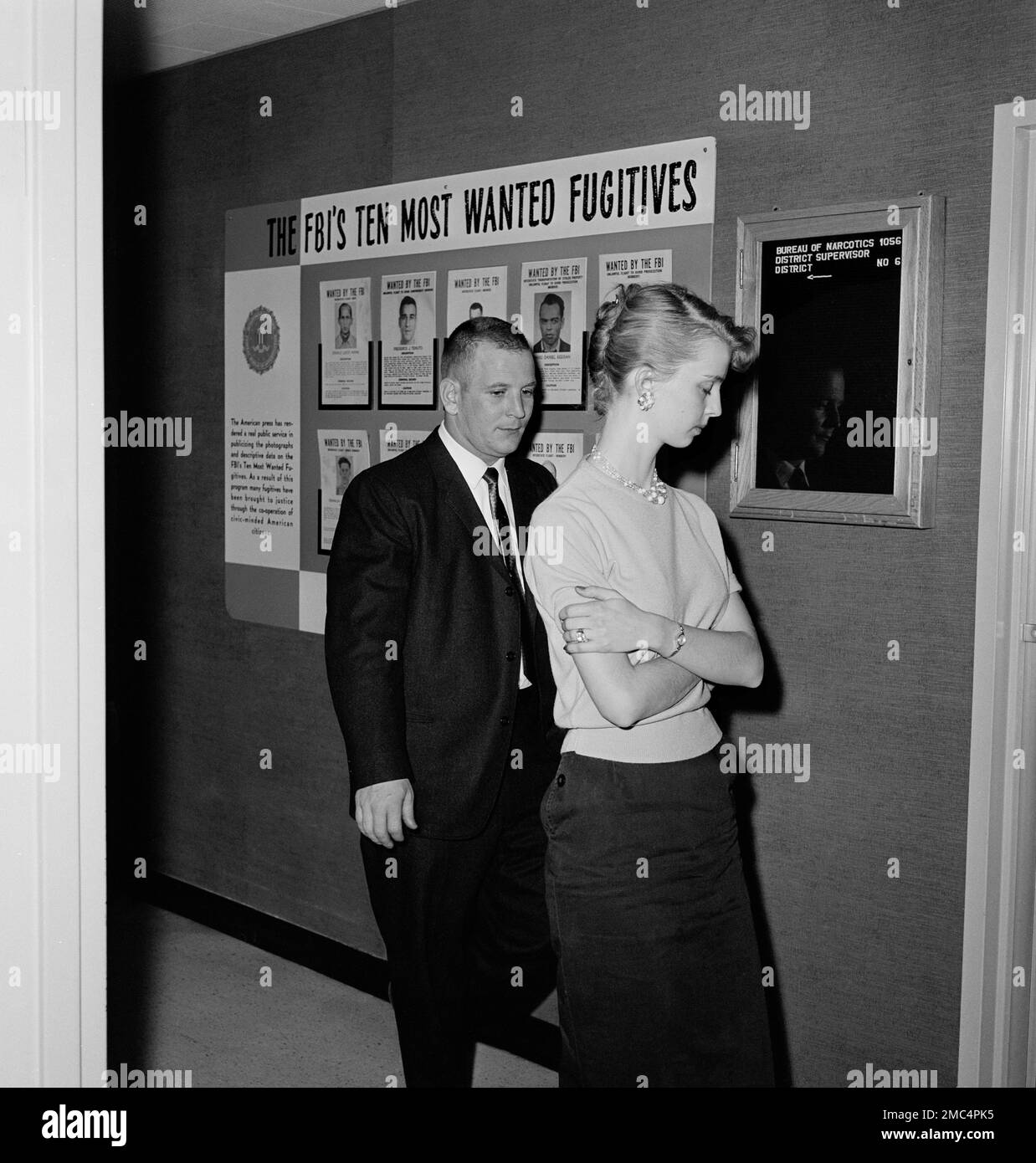 Edward Wayne Edwards, left, and his wife Marlene pass before a bulletin ...