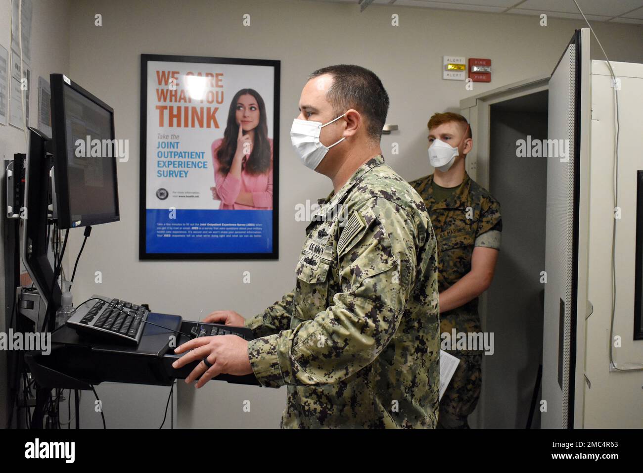 Navy Petty Officer 1st Class Brian Sutton checks in Lance Cpl. William ...