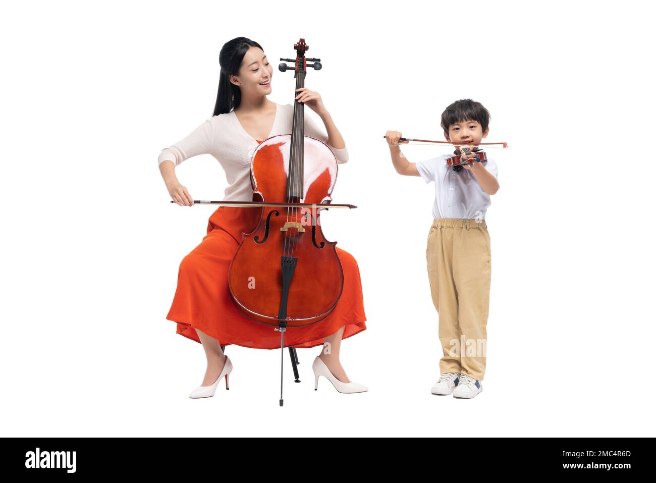 The female teacher guide the boy playing Musical Instruments Stock ...