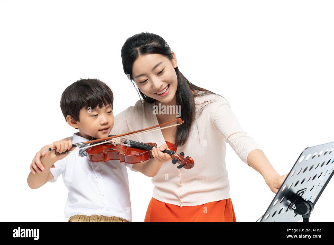 School age children playing instruments hi-res stock photography and ...