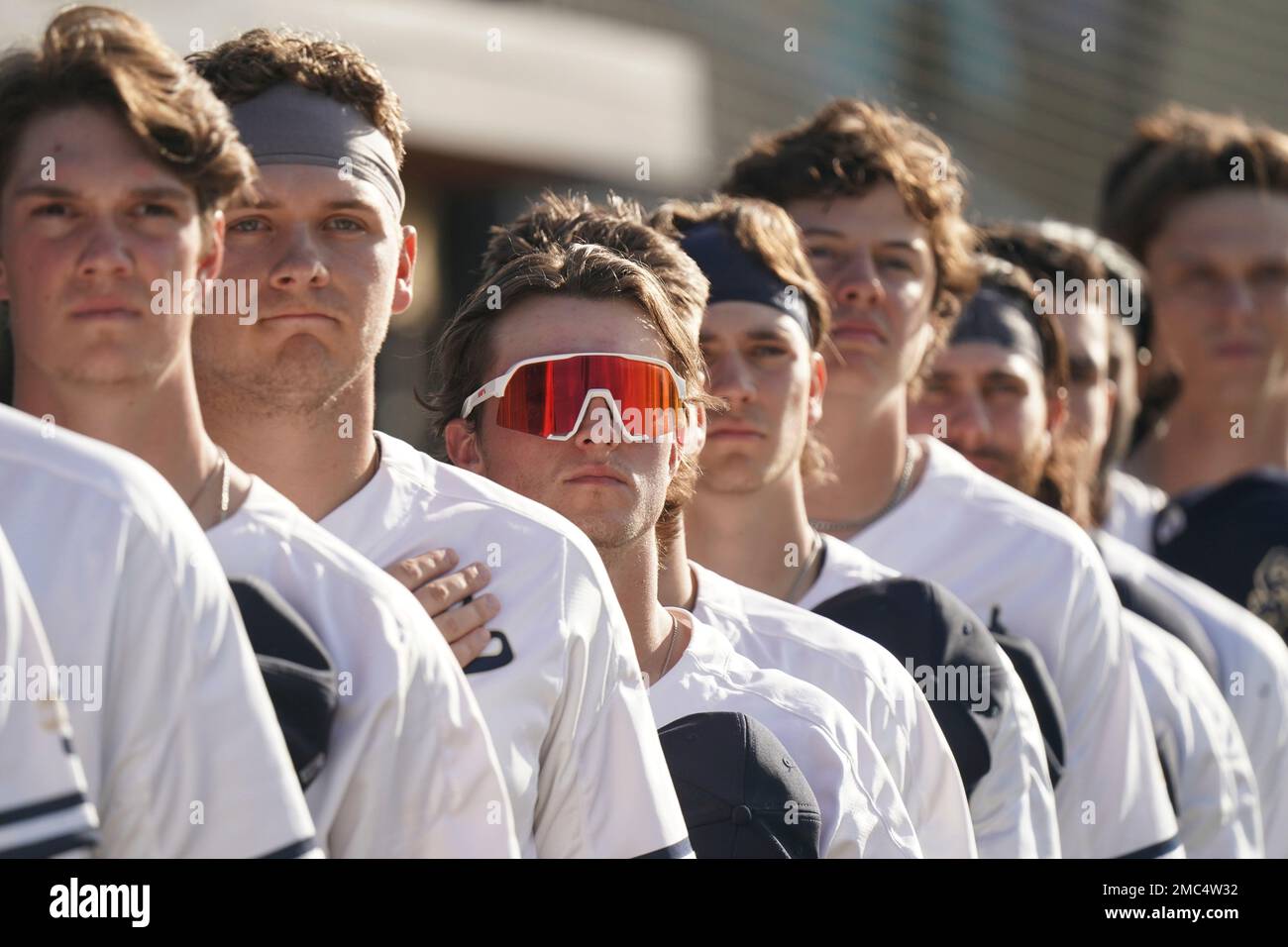 Charelston Southern's Connor Carter stands for the national anthem ...
