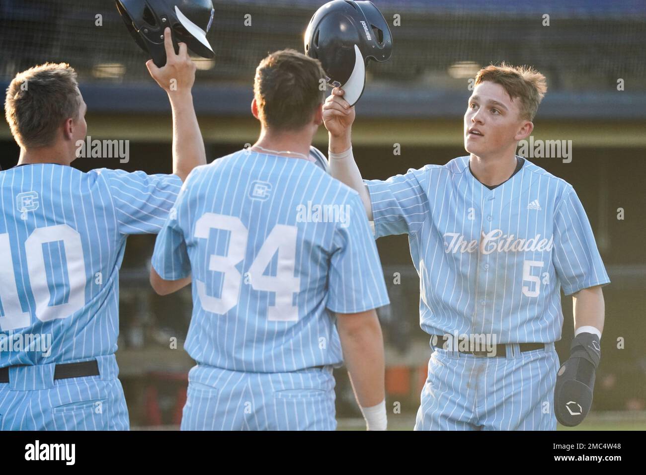 The Citadel's Sawyer Reeves (5), Crosby Jones (10) and Cole Simpson (34) celebrate a home run ...