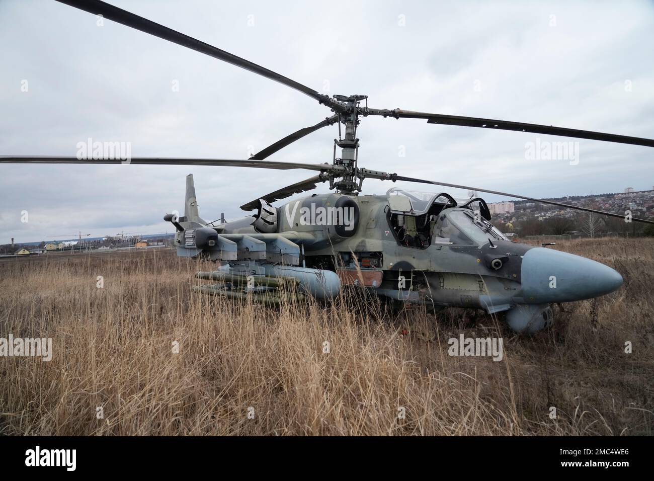 A Russian Ka-52 helicopter gunship is seen in the field after a forced ...