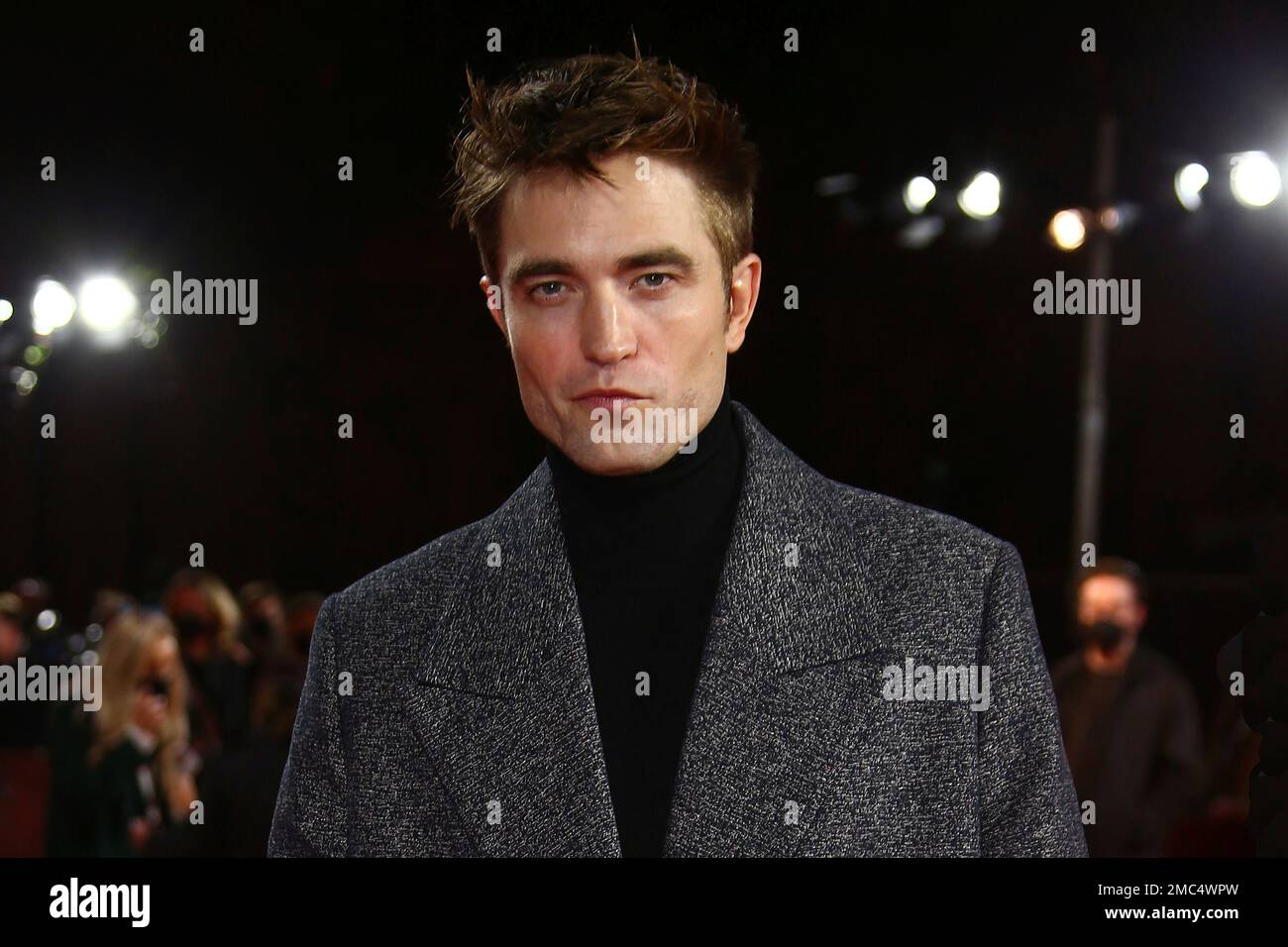 Robert Pattinson poses for photographers upon arrival for the screening ...