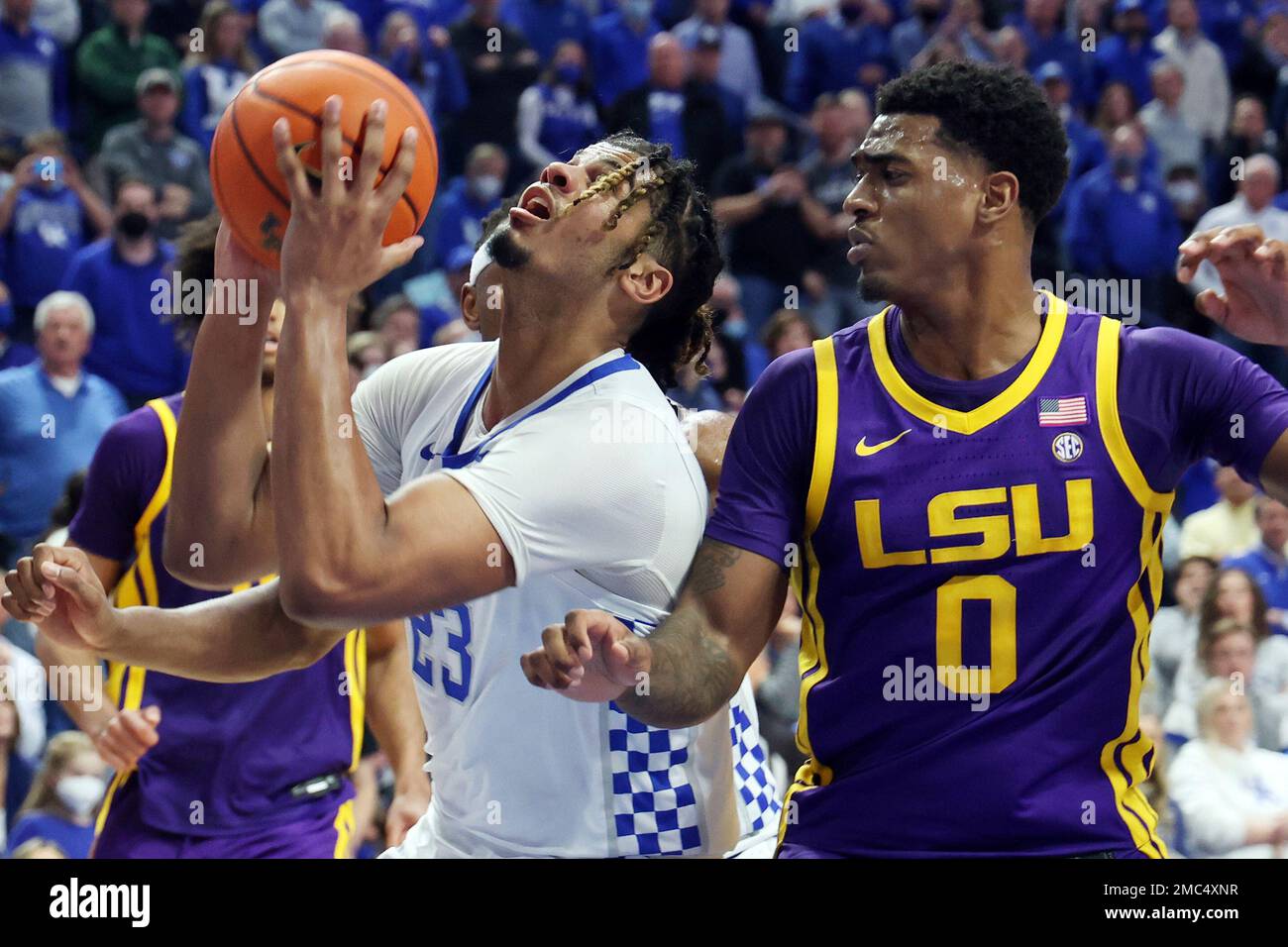 Kentucky's Bryce Hopkins (23) shoots next to LSU's Brandon Murray (0 ...