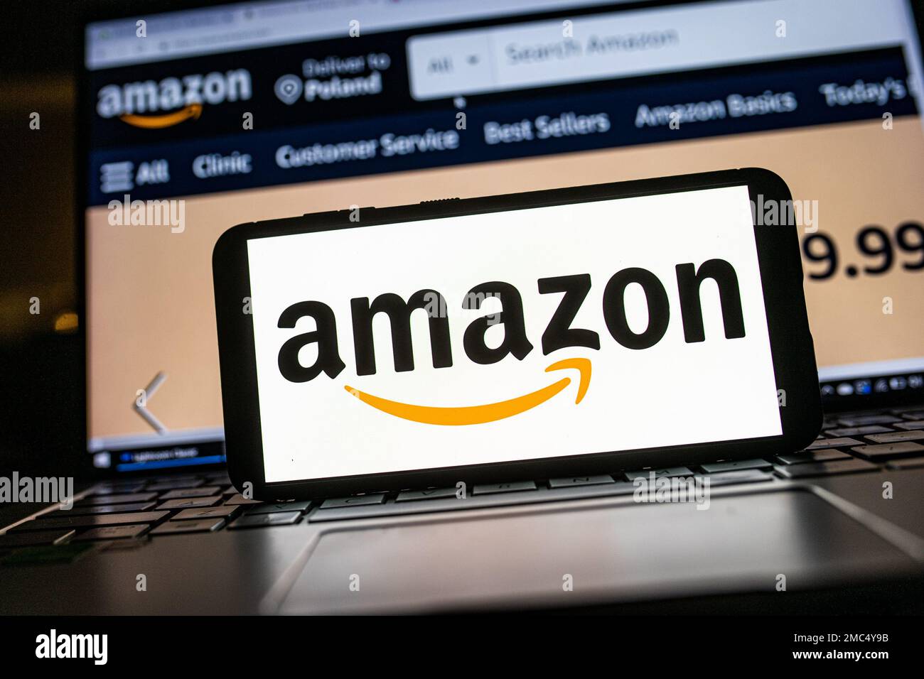 In this photo illustration an Amazon logo seen displayed on a ...