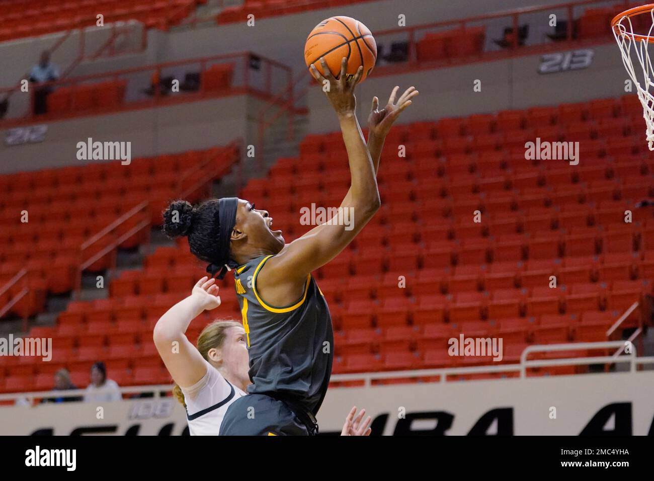 Baylor center Queen Egbo, right, shoots in front of Oklahoma State ...