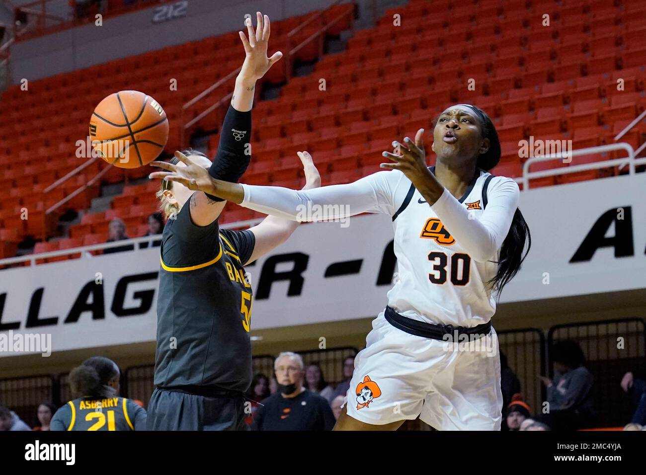 Oklahoma State guard Sara Rodrigues (30) is fouled by Baylor forward ...